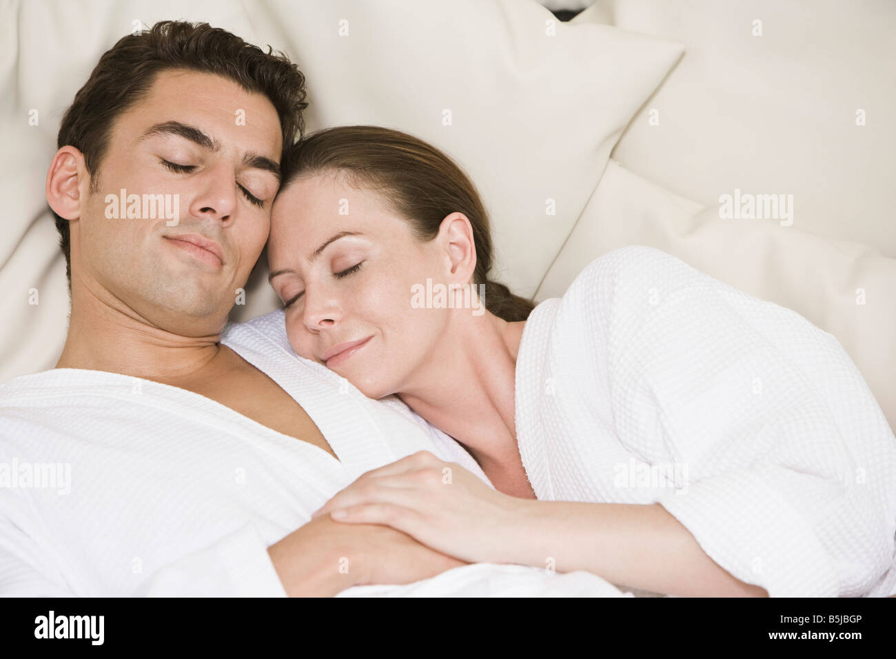 couple sleeping in close embrace Stock Photo - Alamy