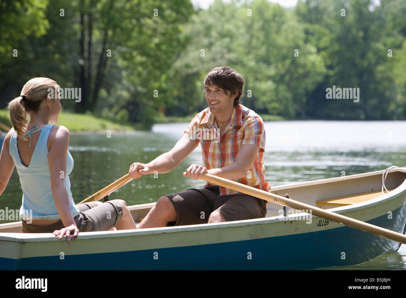 Blonde person rowing boat hi-res stock photography and images - Alamy