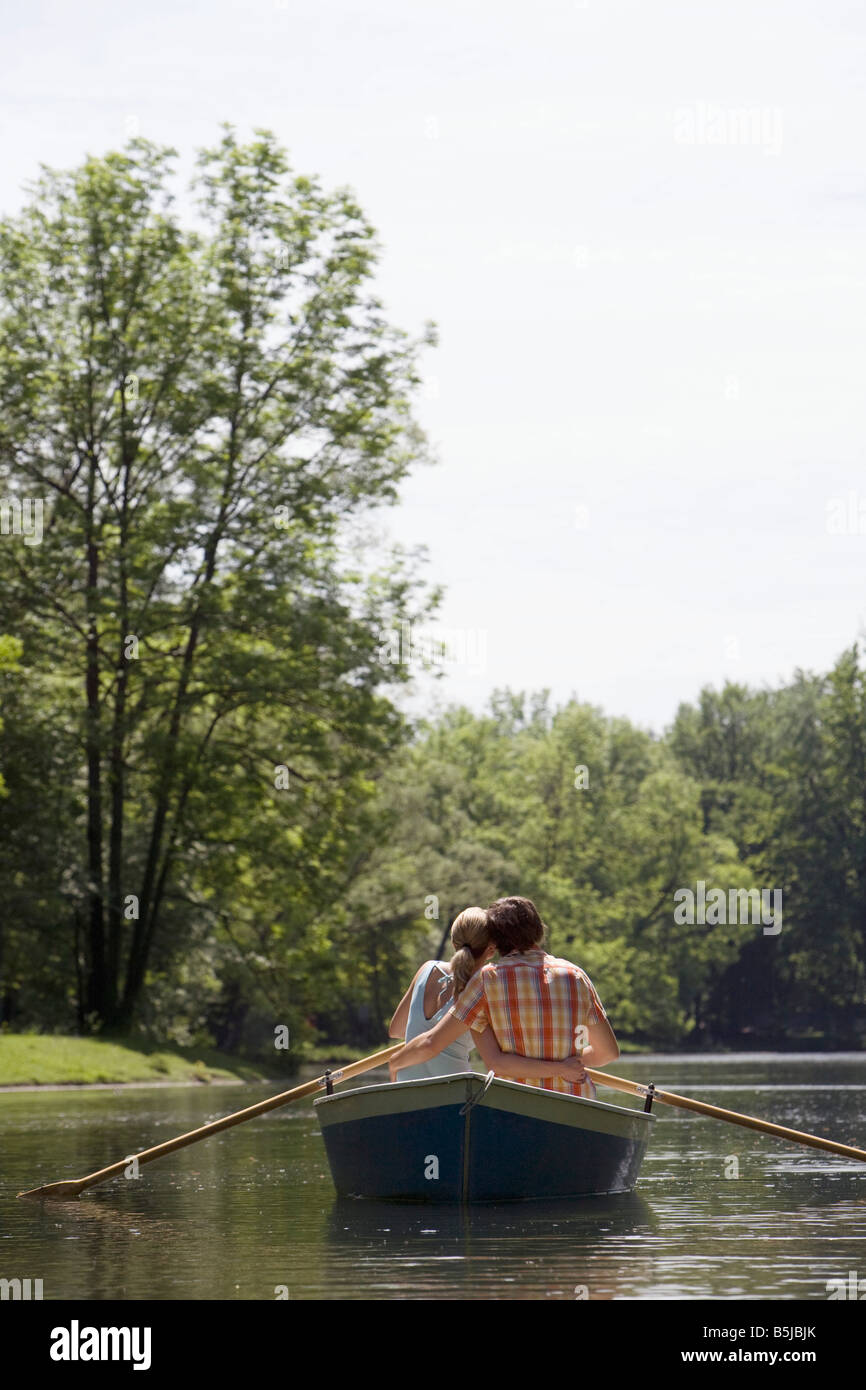 rear view of couple embracing in rowing boat Stock Photo - Alamy