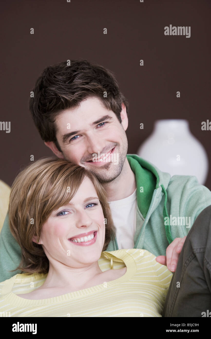 portrait of young couple relaxing at home Stock Photo - Alamy