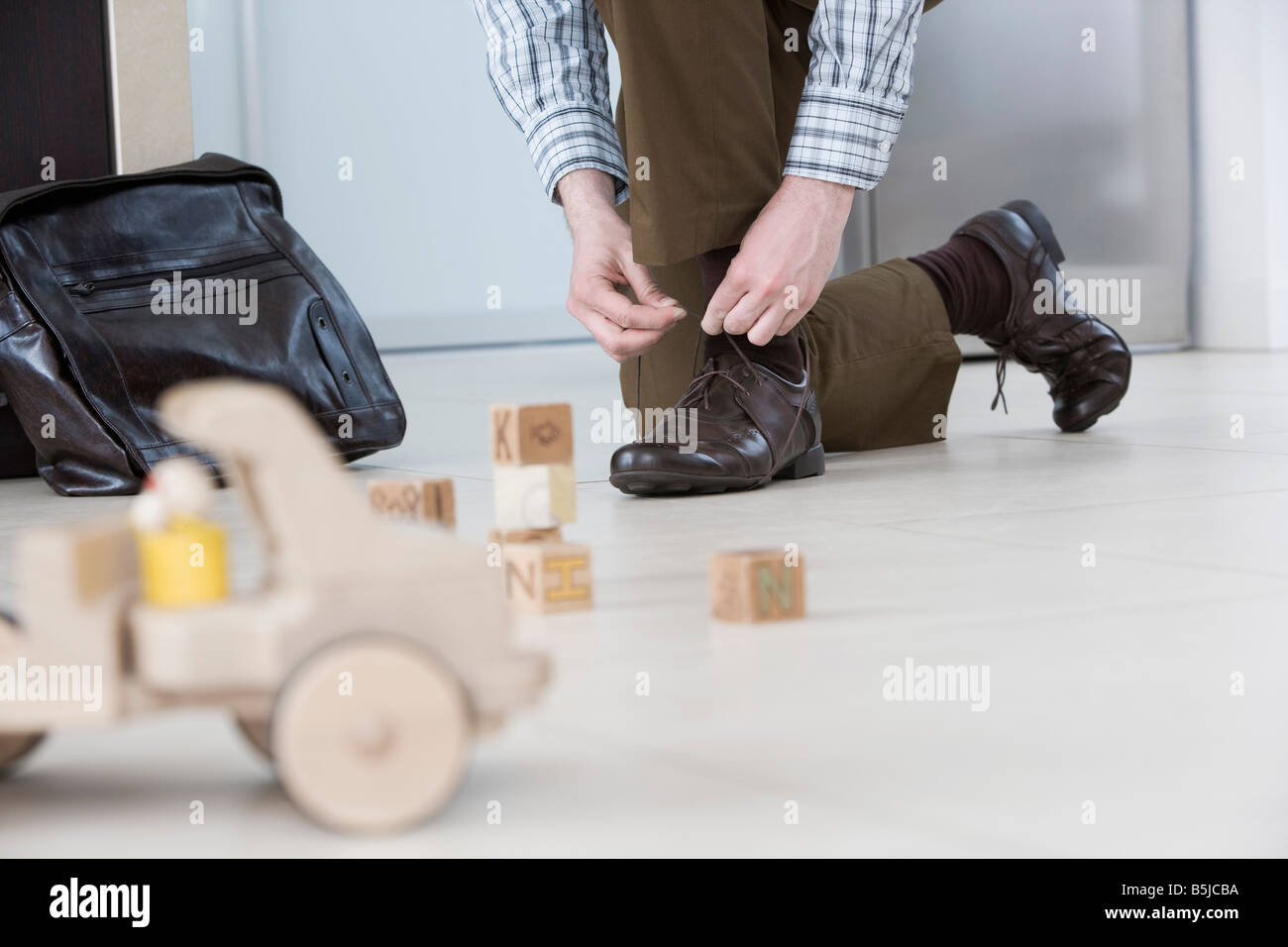 detail of man binding his shoes Stock Photo - Alamy