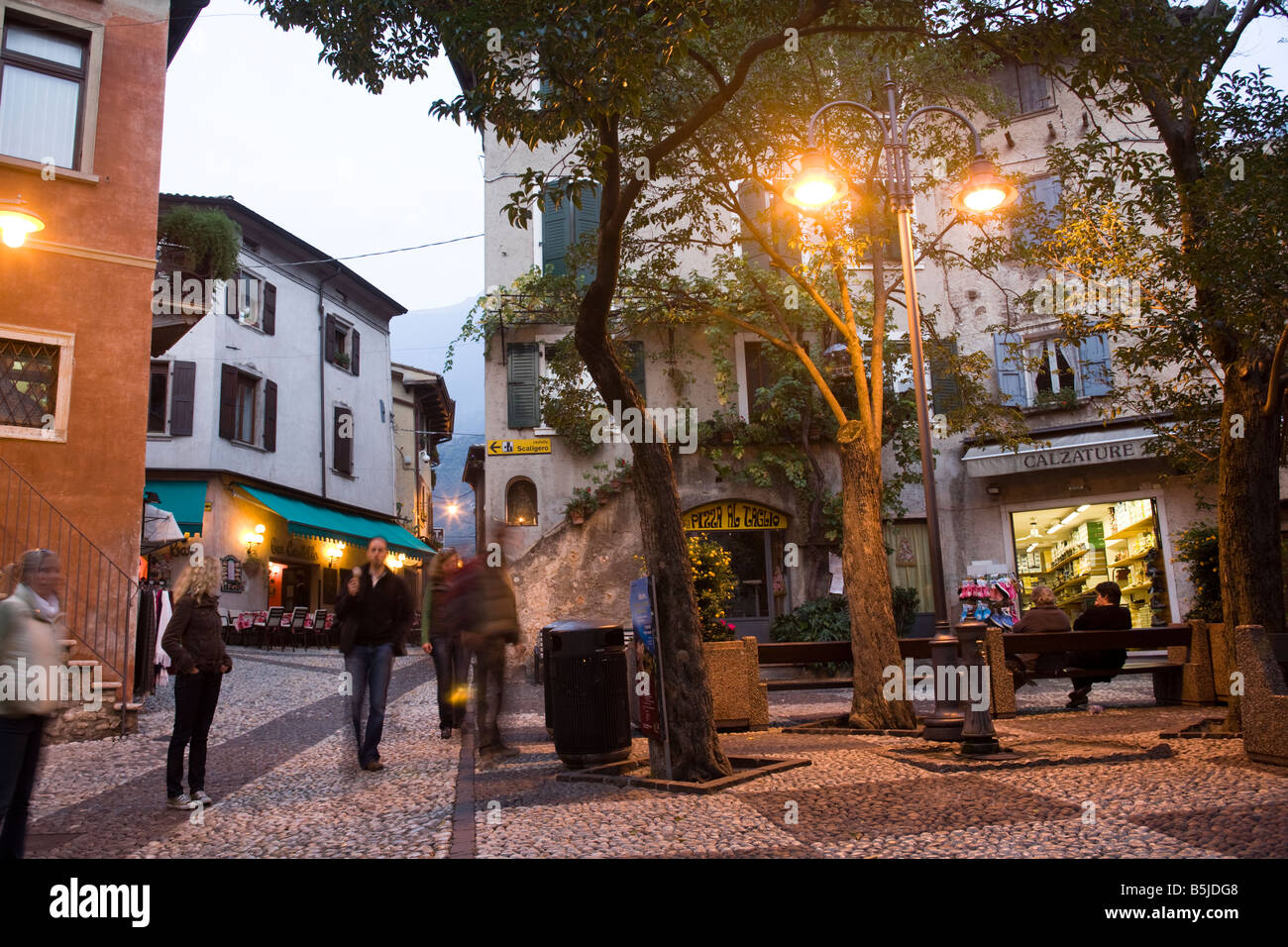 Malcesine, Veneto, Italy. Tourists and local people walking in the ...