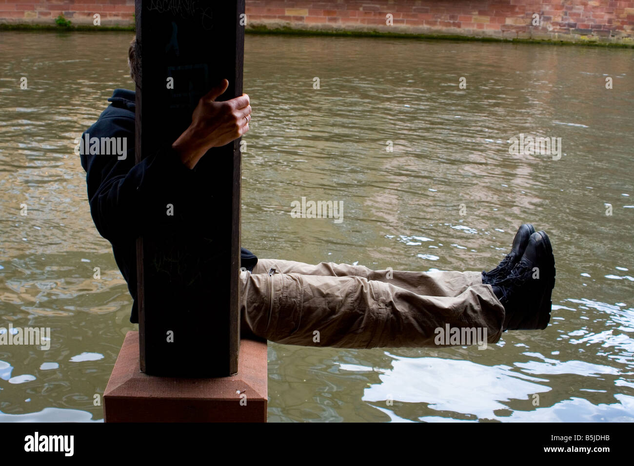 Man Hanging By One Arm Stock Photos & Man Hanging By One Arm Stock ...