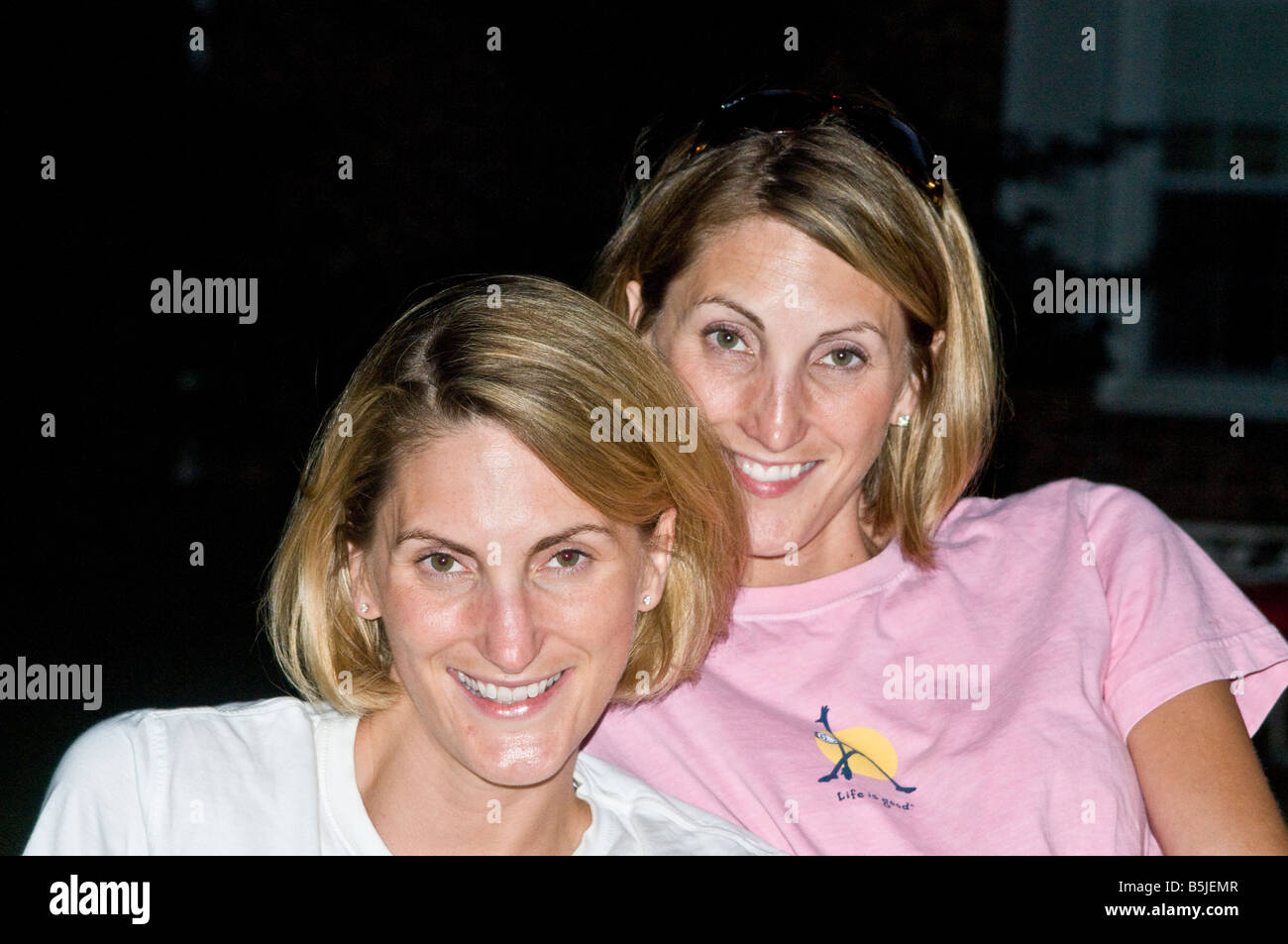 two twin sisters at family picnic gathering Stock Photo - Alamy