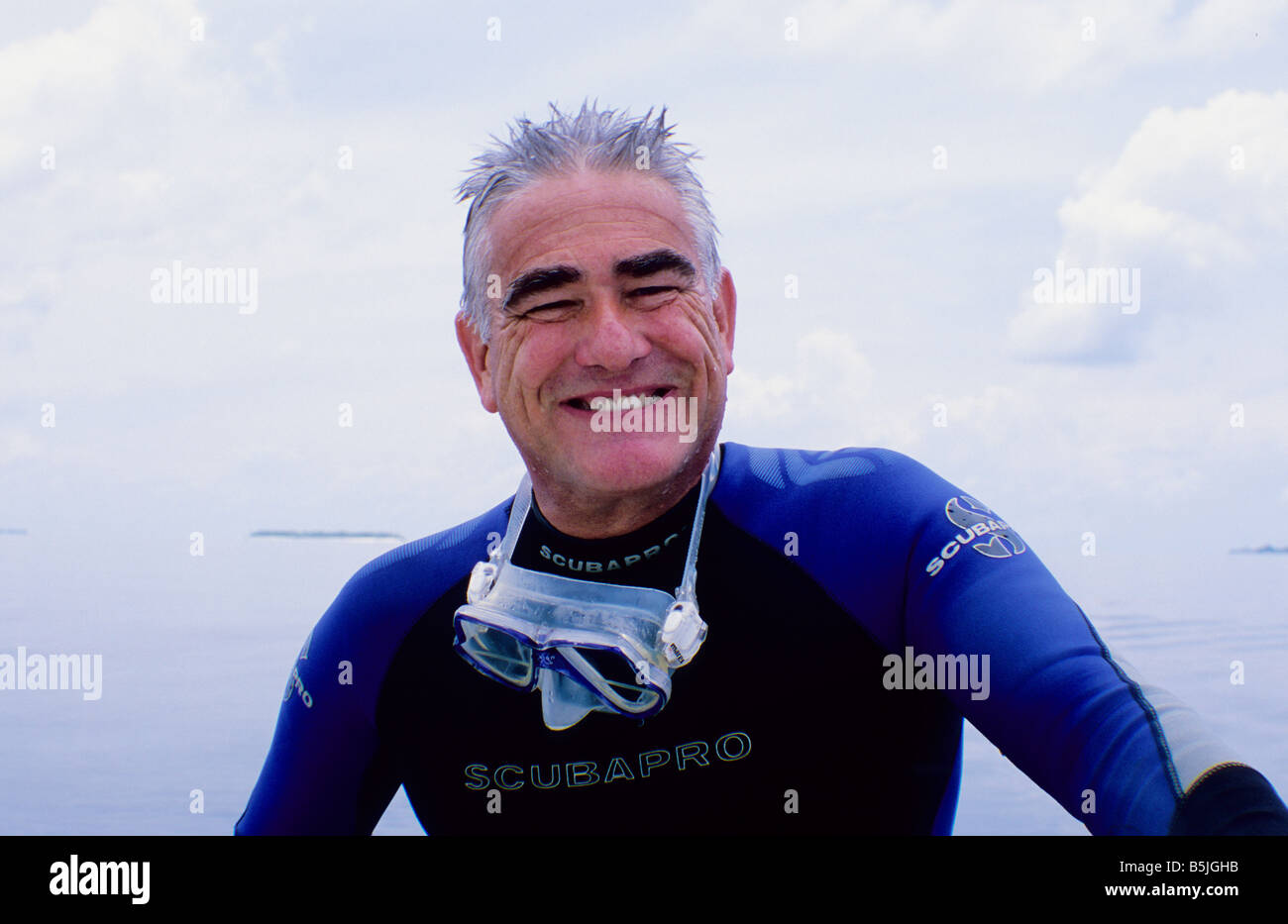 Scuba diver relaxes onboard the recovery boat, following a successful ...