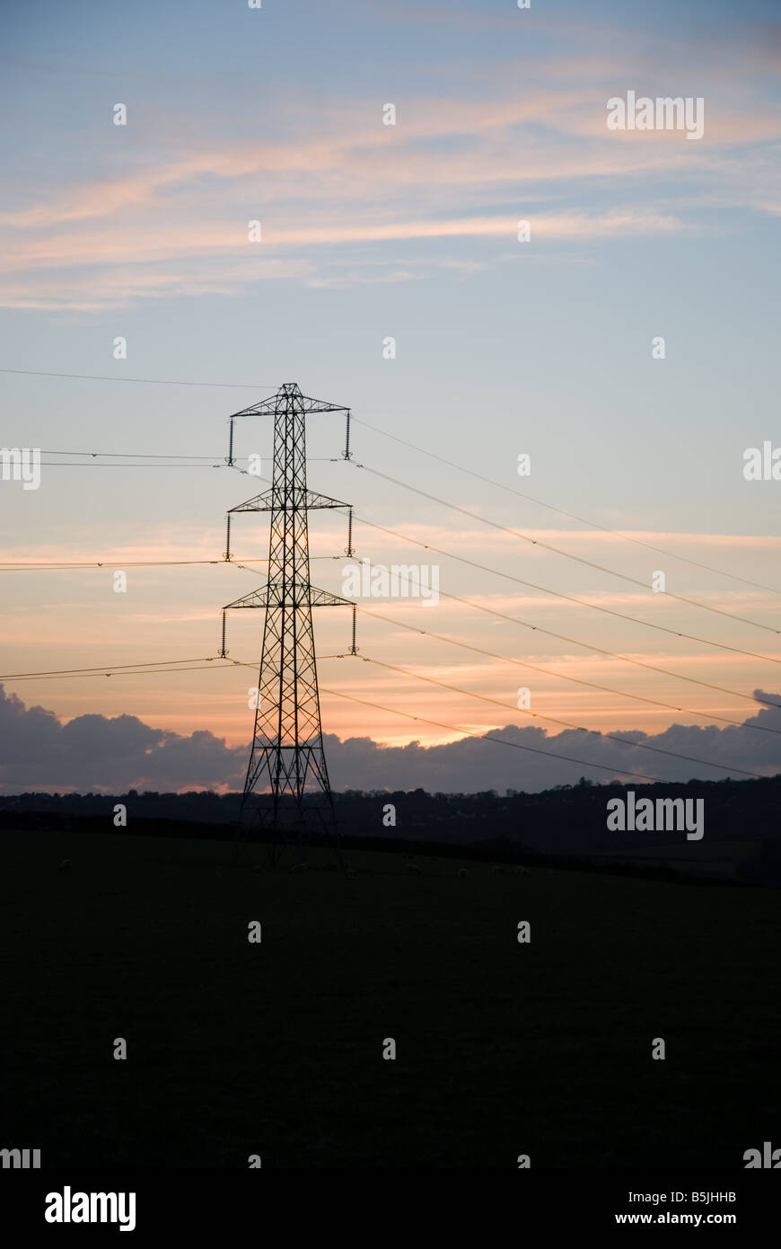 Electricity Pylons at Sunset Stock Photo - Alamy