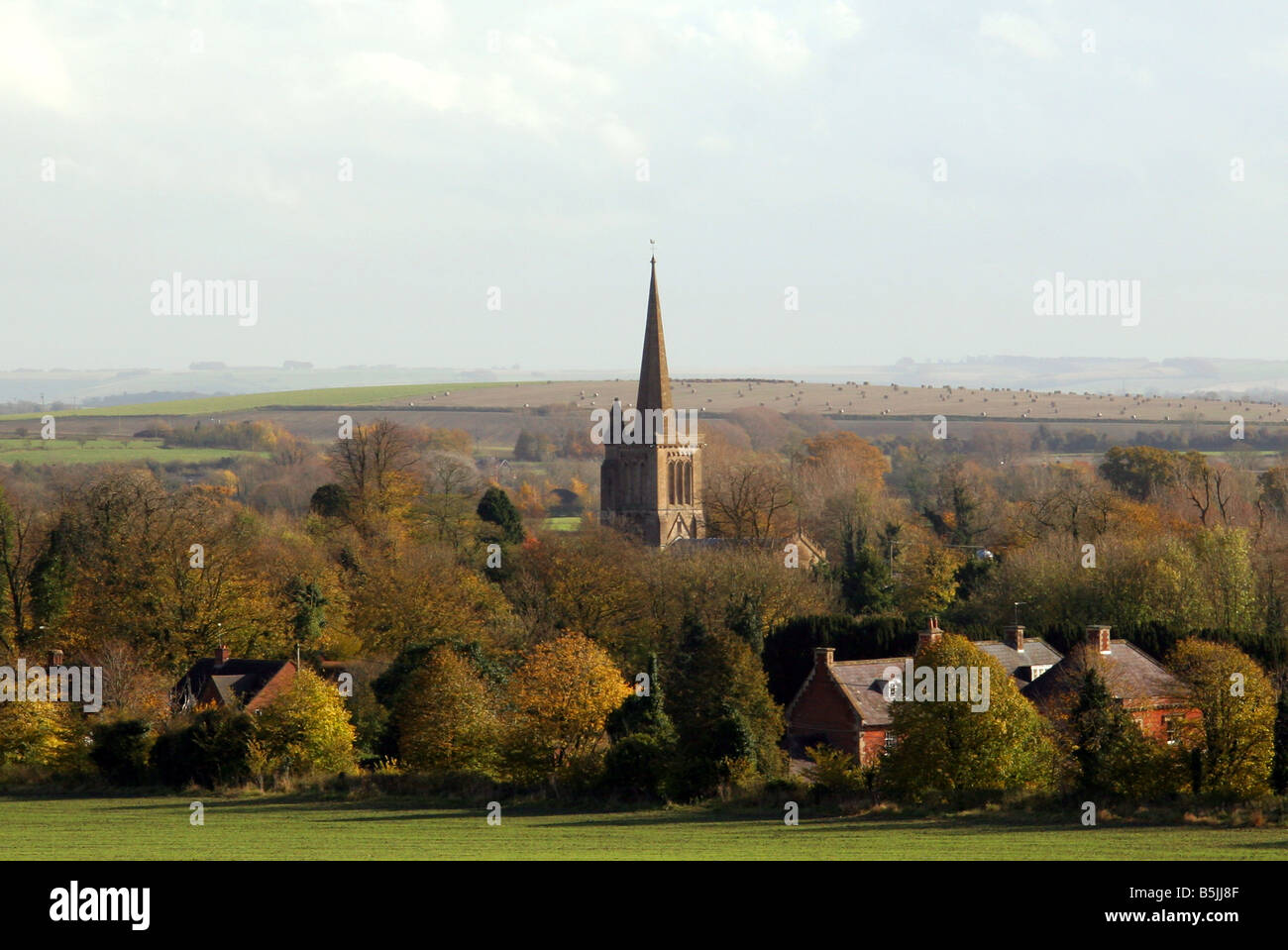 Old church spire and small English village Stock Photo - Alamy