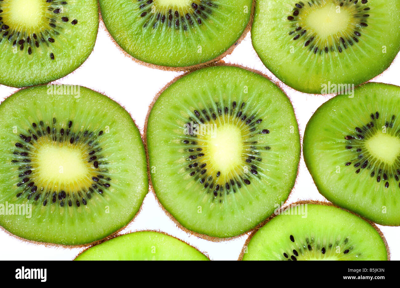 Green ripe kiwi fruit macro sliced cuts isolated on white food ...
