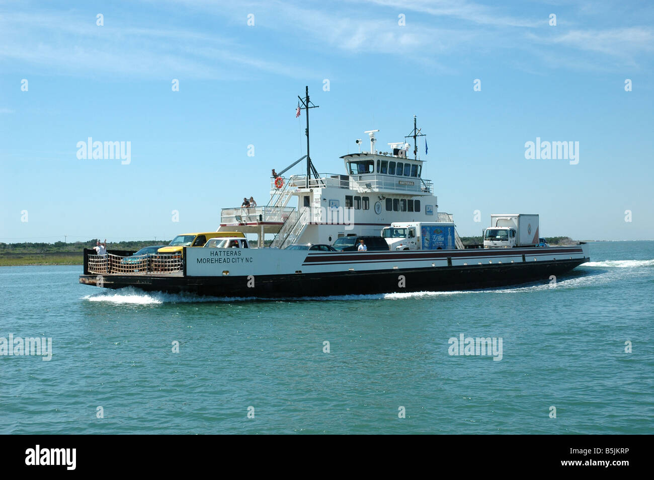 A ferry transporting passengers and vehicles Stock Photo - Alamy