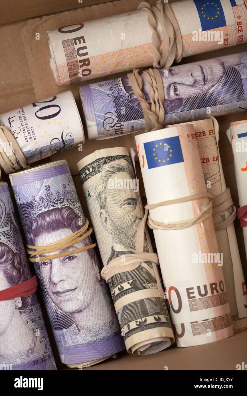 wads of 20 pounds sterling bank of england notes euros and dollars cash ...