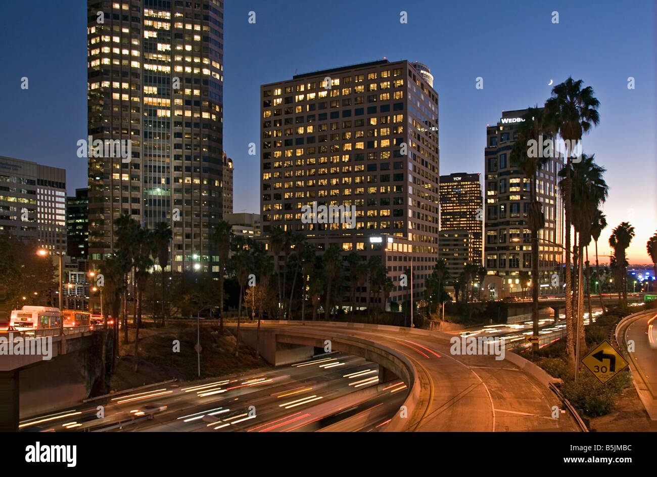 US 101, Harbor Freeway LA skyline High Rise buildings Dusk Los Angeles ...