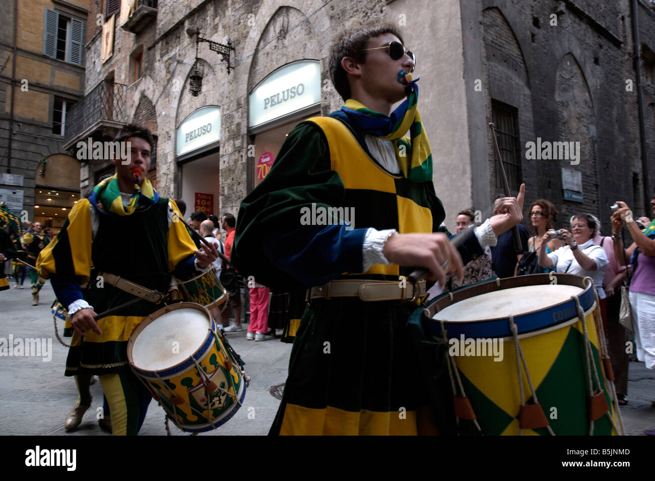 The Bruco 'caterpillar' contrada march through the city in celebration ...
