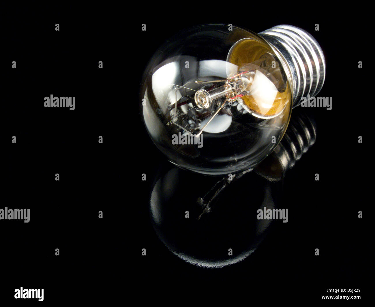 Light Bulb on Black Background Stock Photo - Alamy