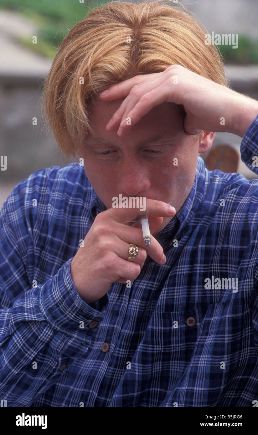 teenage boy smoking cigarette Stock Photo - Alamy