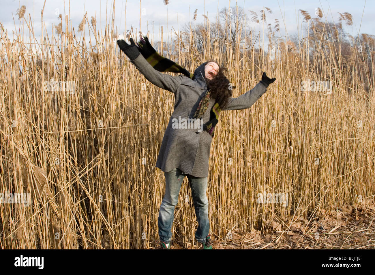 Exuberant teenage girl in Prospect Park on a winter day in Brooklyn New ...