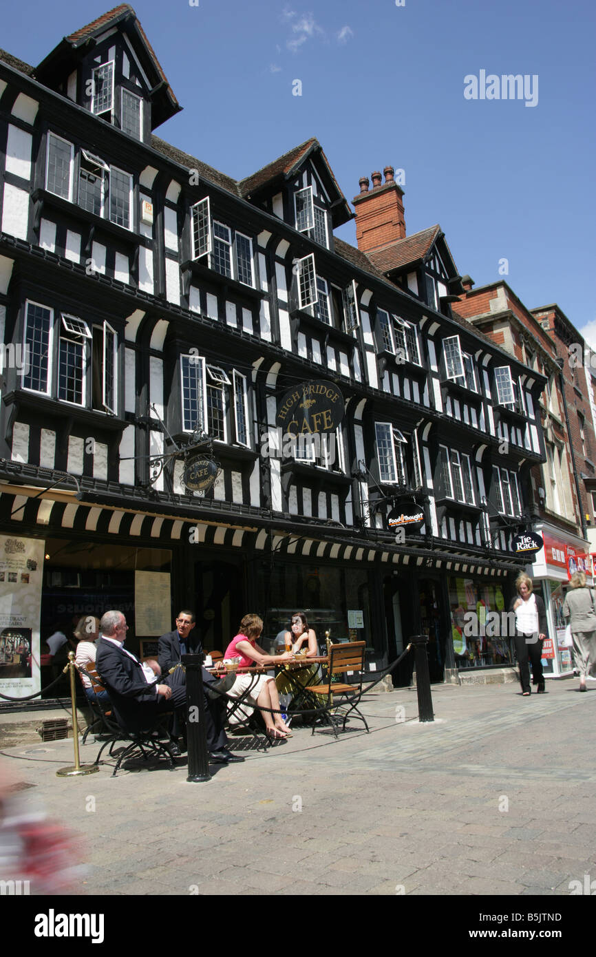 City of Lincoln, England. Shoppers, visitors and workers enjoying lunch ...