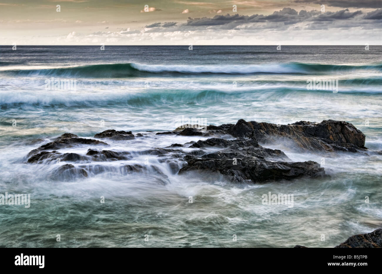fine art image of strong and resilient rocks at the sea Stock Photo - Alamy