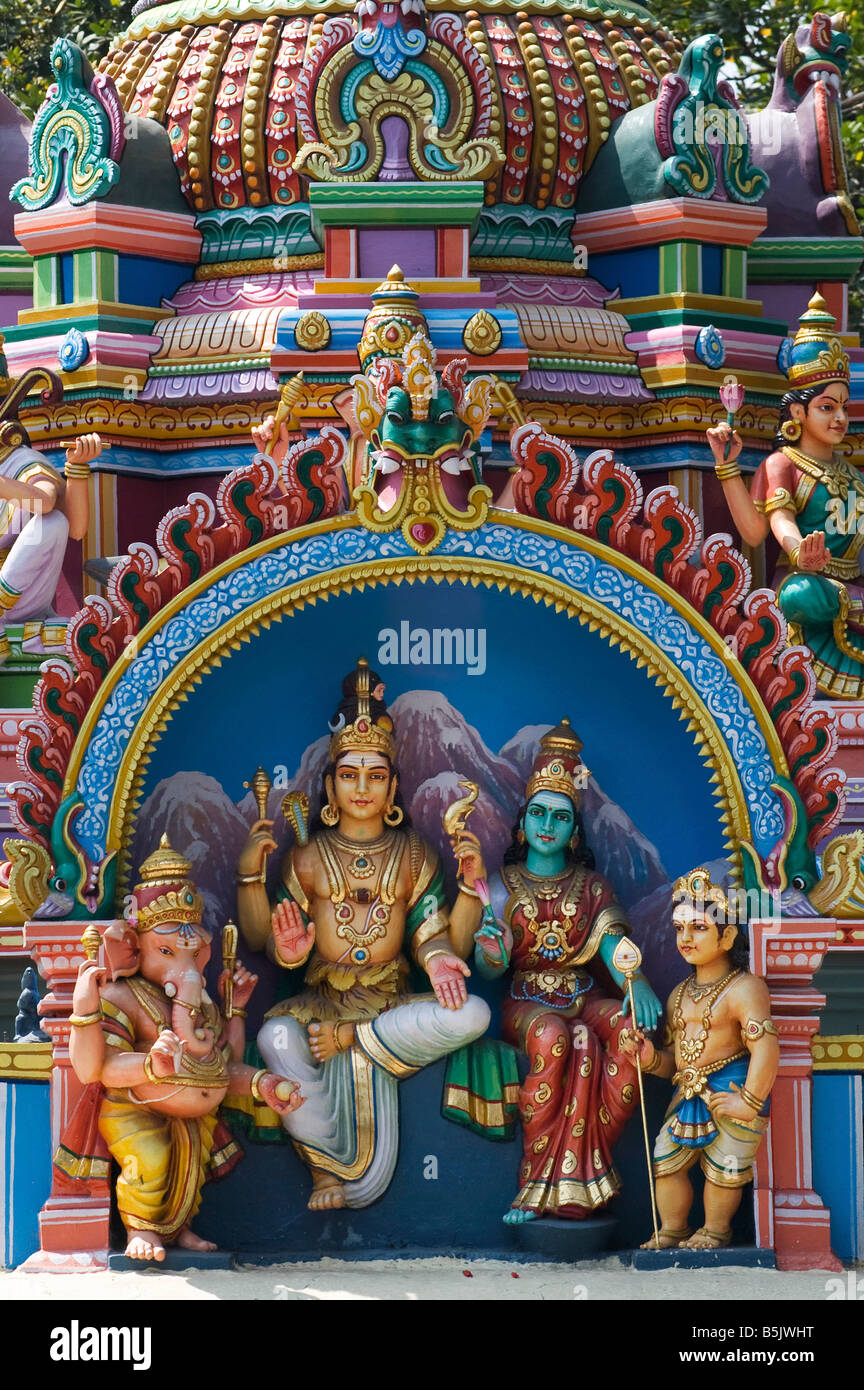 Hindu deities, sculpted painted statues, on a hindu temple in Banglore ...