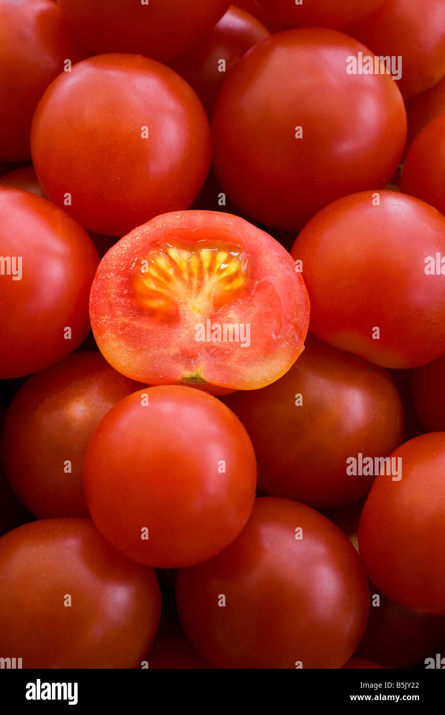 Freshly picked and cut gardeners delight tomatoes UK Stock Photo - Alamy