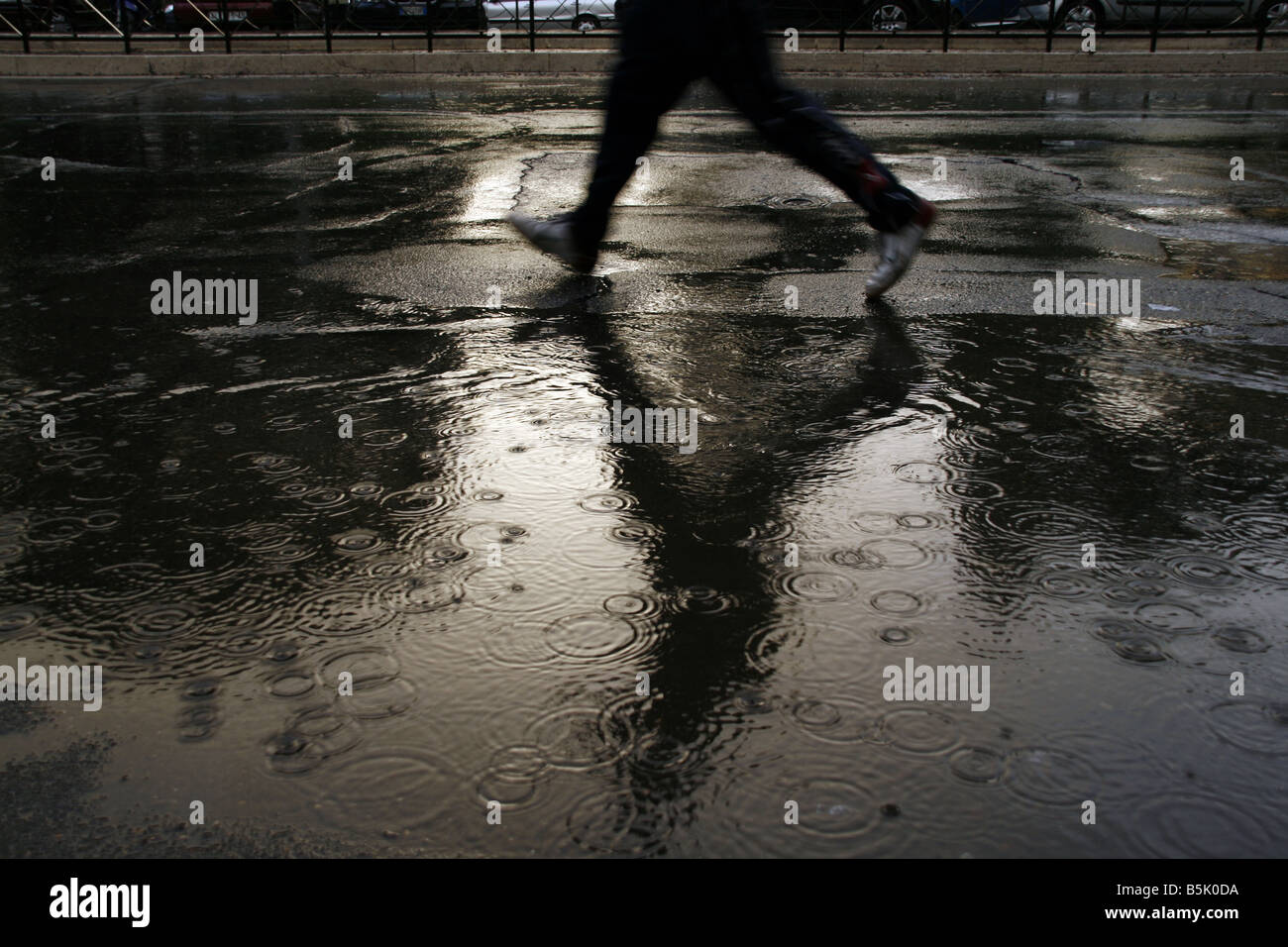 Falling In The Puddle Rain Drops Falling In Mud Puddle.