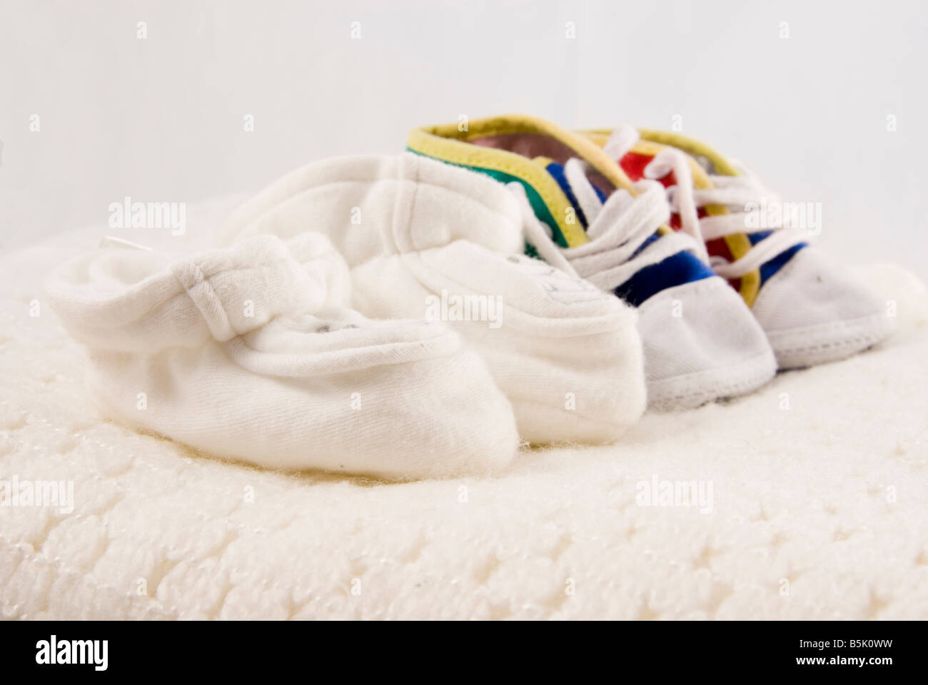Two pairs of baby shoes hi-res stock photography and images - Alamy