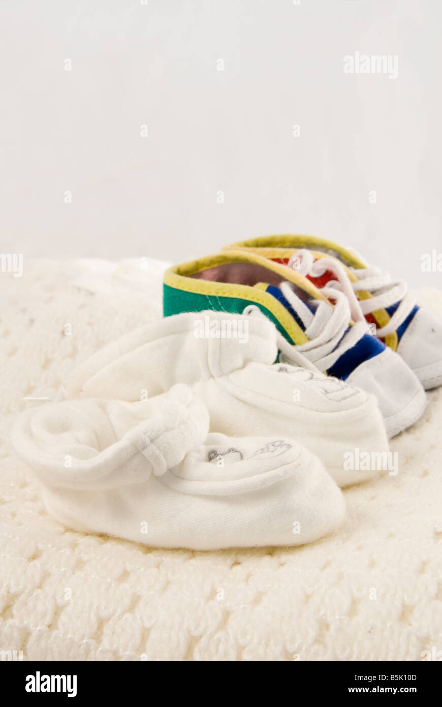Two pairs of baby shoes hi-res stock photography and images - Alamy