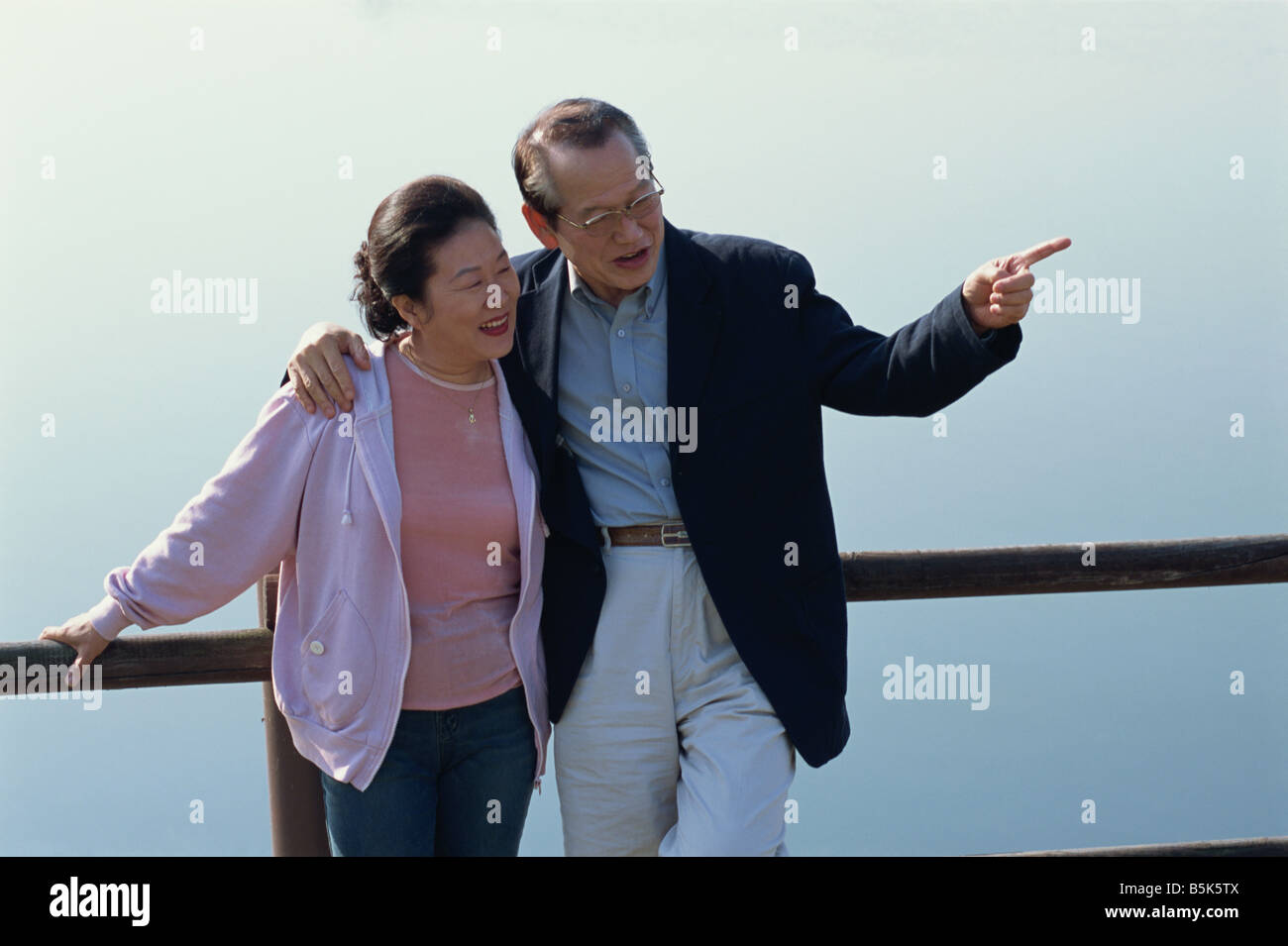 Asian man standing around old hi-res stock photography and images - Alamy