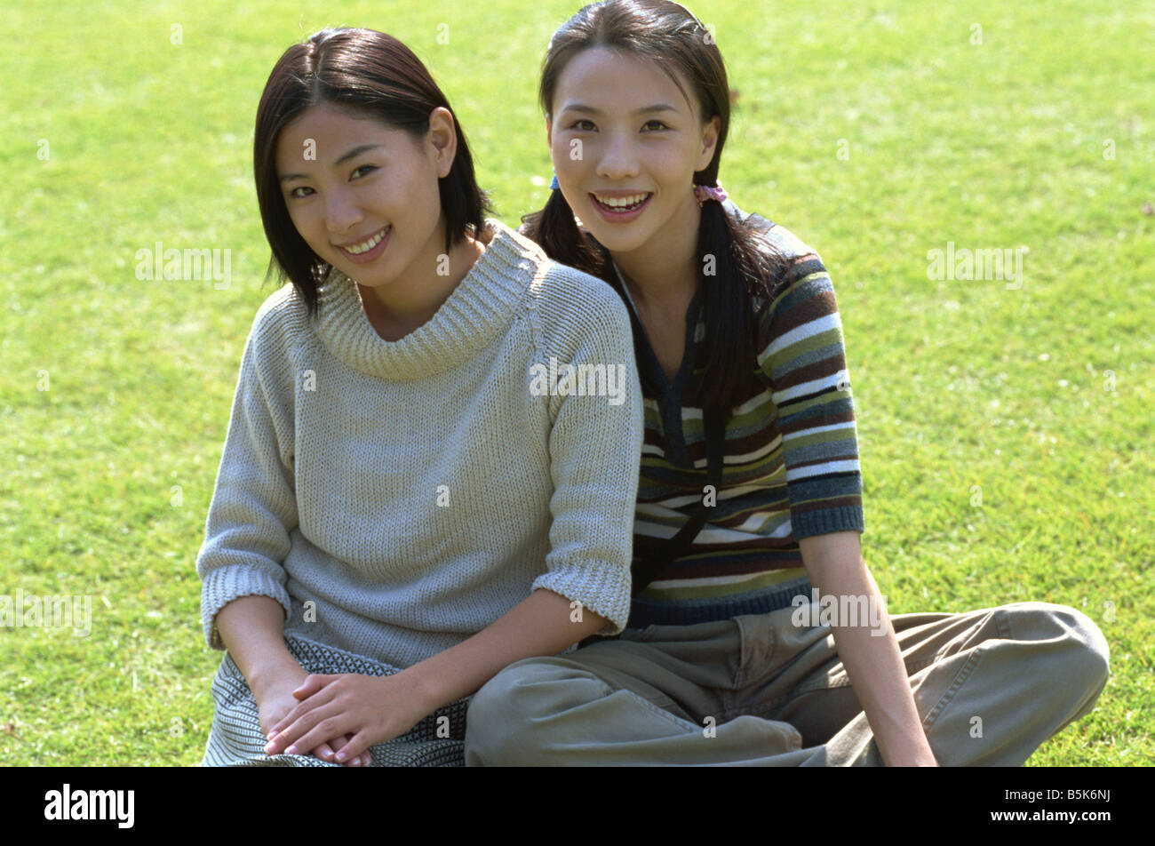 A portrait of two young Asian women Stock Photo - Alamy