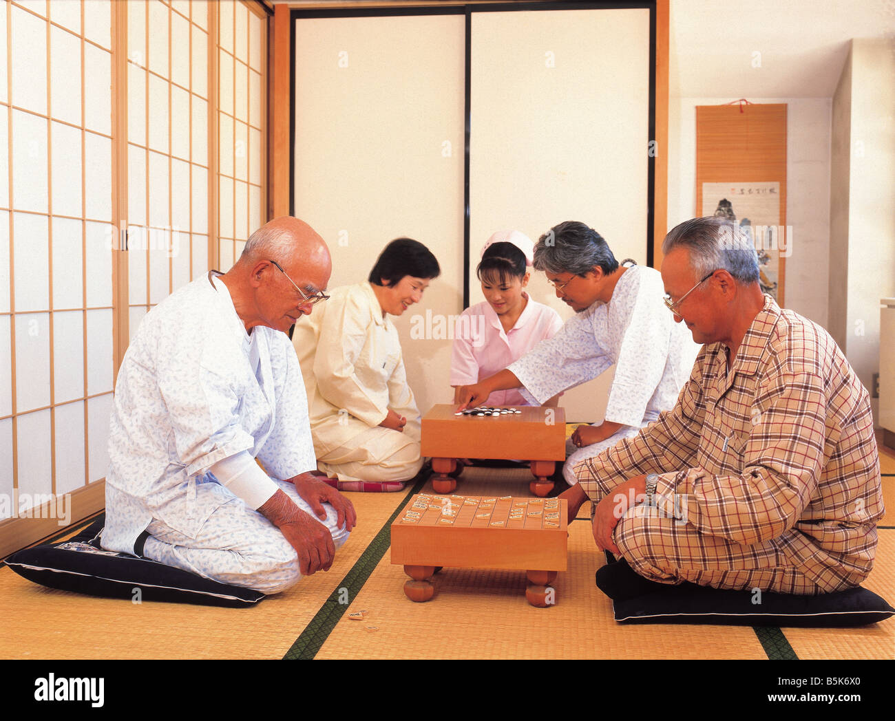 Group men sit talk japan hi-res stock photography and images - Alamy