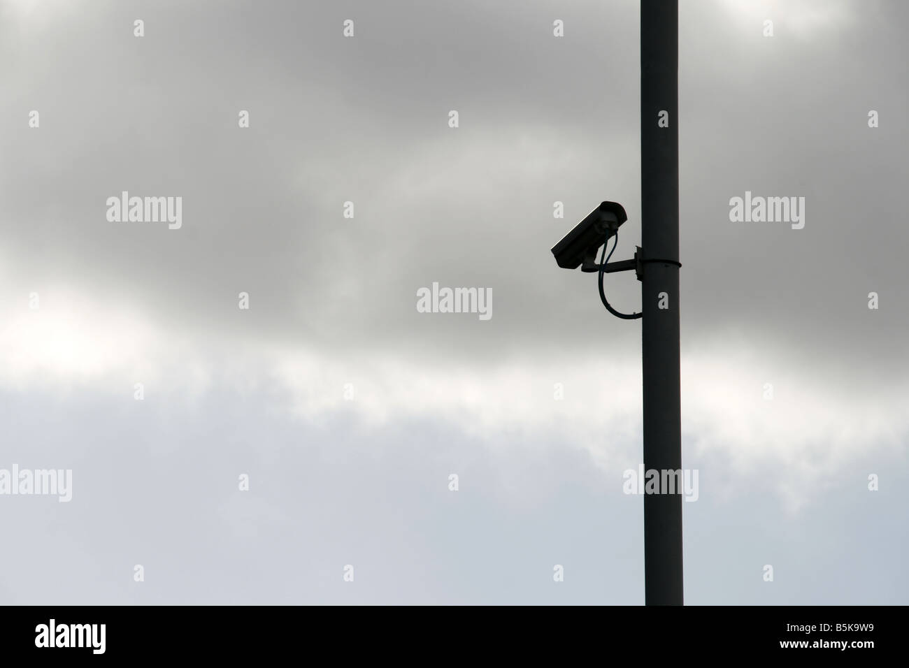 one cctv camera silhouette outdoors with dark cloudy sky Stock Photo ...