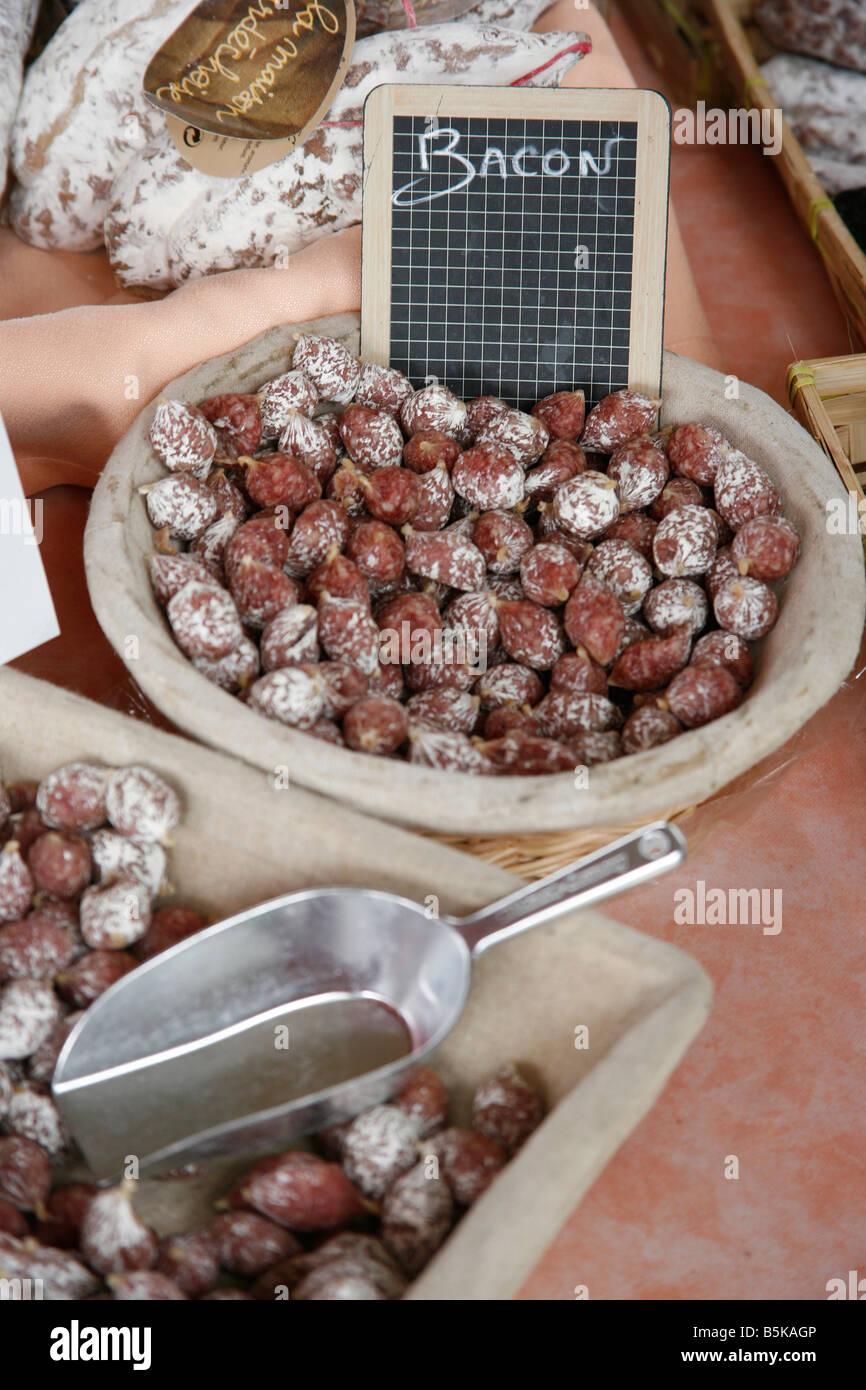 Dried bacon saucisson balls on display in market France Stock Photo - Alamy