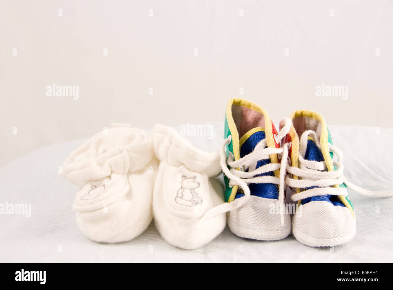 Two pairs of baby shoes hi-res stock photography and images - Alamy