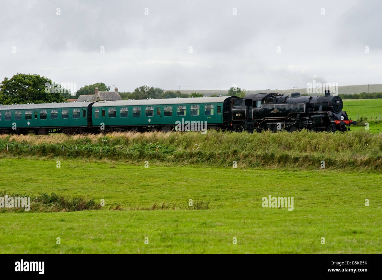 Steam train on the Swanage Railway approaching Harman's Cross station ...