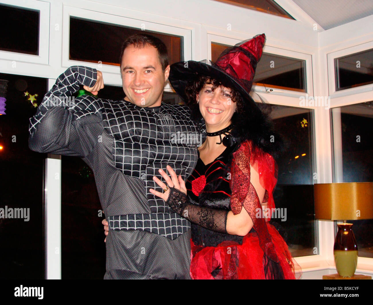 A bewitched Spiderman with his mask off and the witch that made the ...