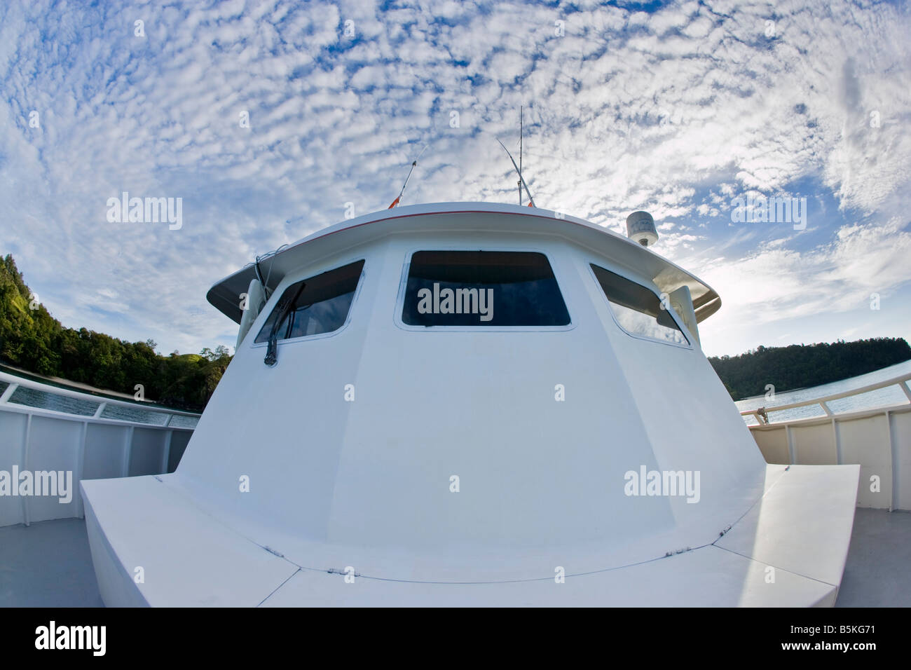 View of a diving ship bow against a blue sky with beautiful cloudscape ...