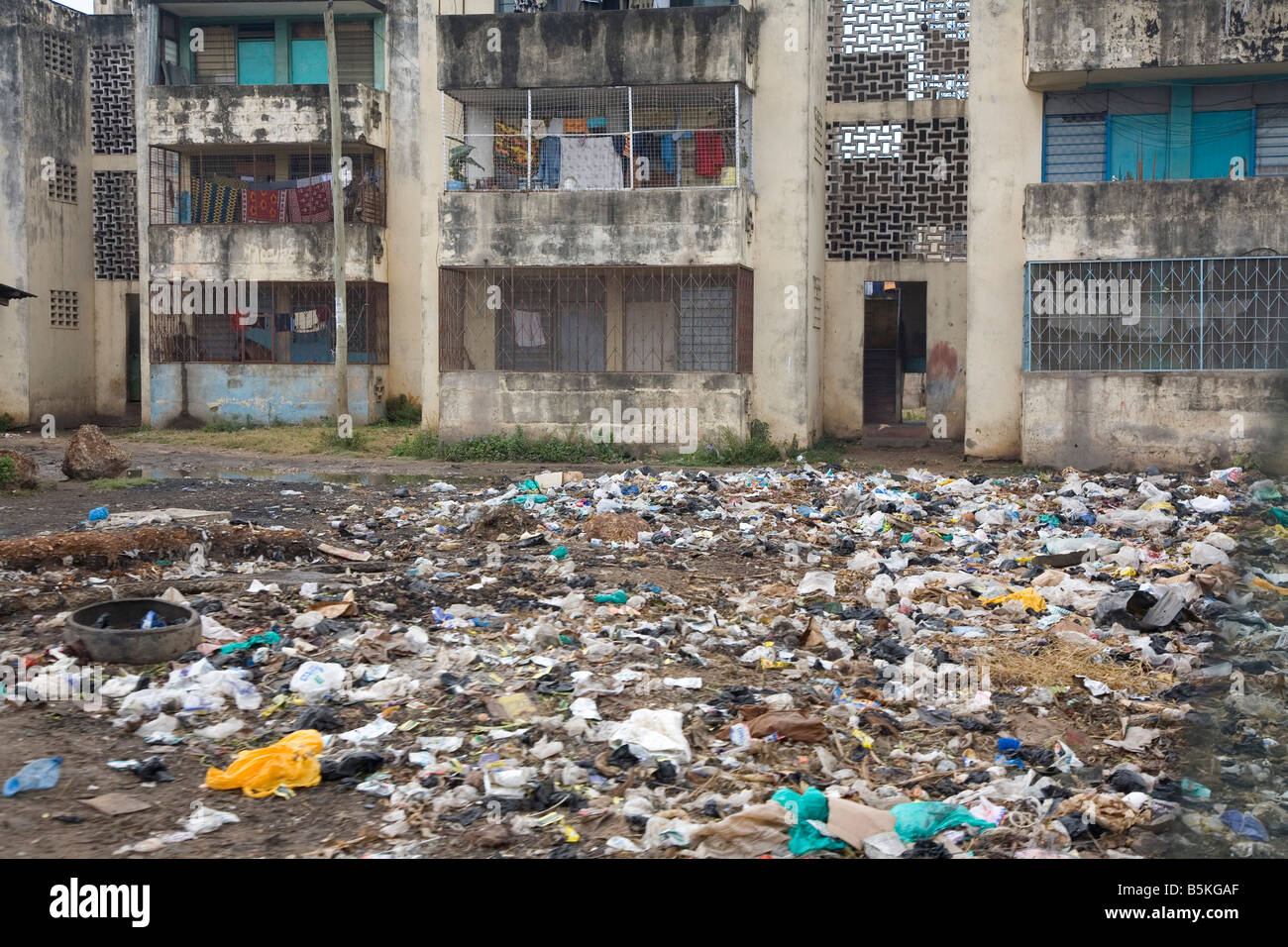 Rubbish outside housing block Stock Photo - Alamy
