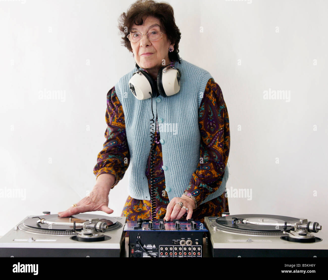 a very funky senior dj scratches Stock Photo - Alamy