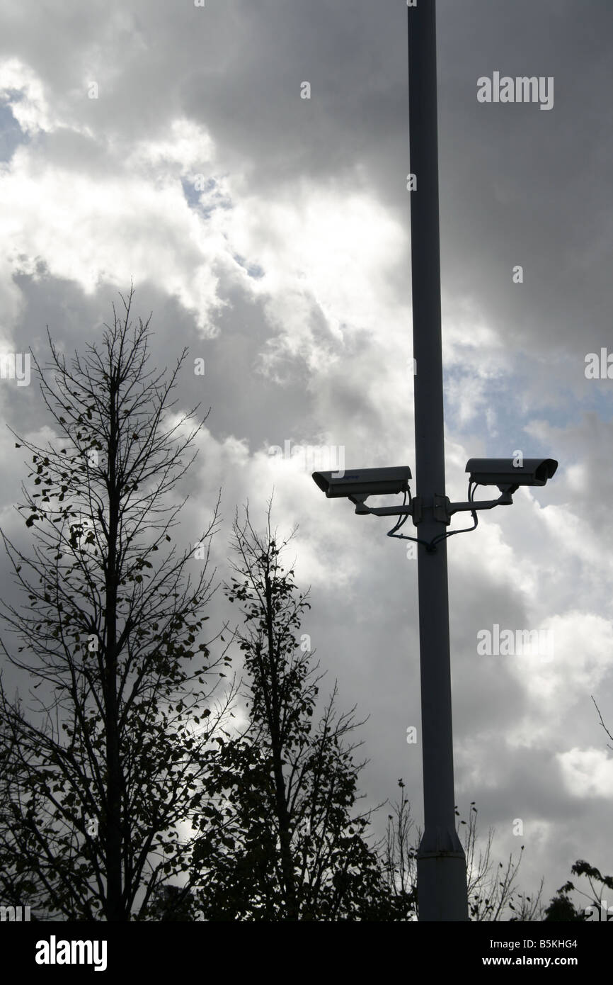 two cctv cameras silhouette on high pole outdoors Stock Photo - Alamy