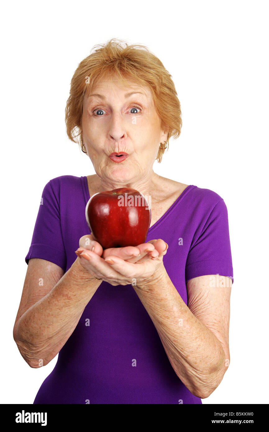 Senior lady excited about the shiny red apple she s about to eat ...