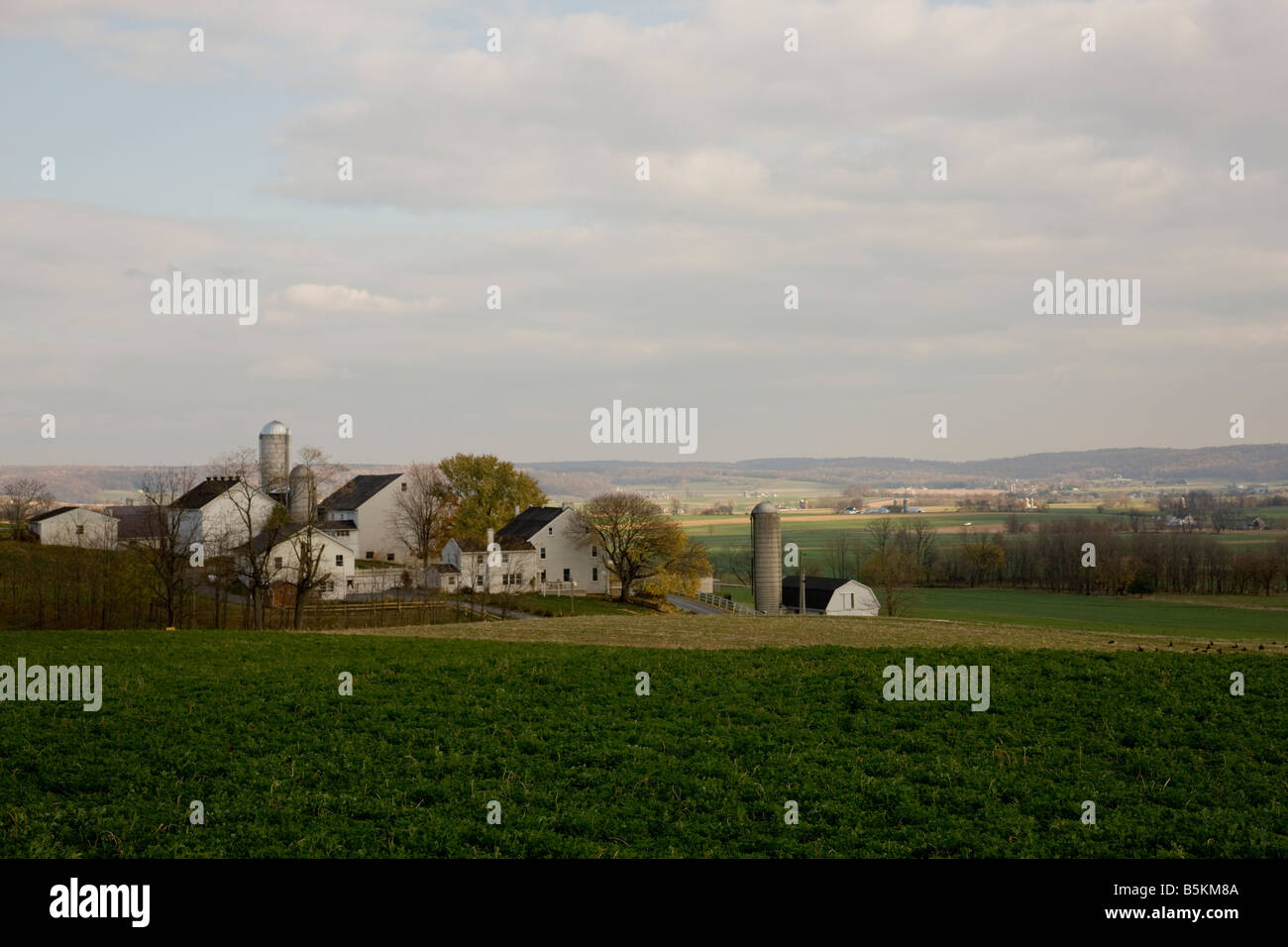 An Amish farm nestles in a valley near Lancaster, Pennsylvania. Other ...