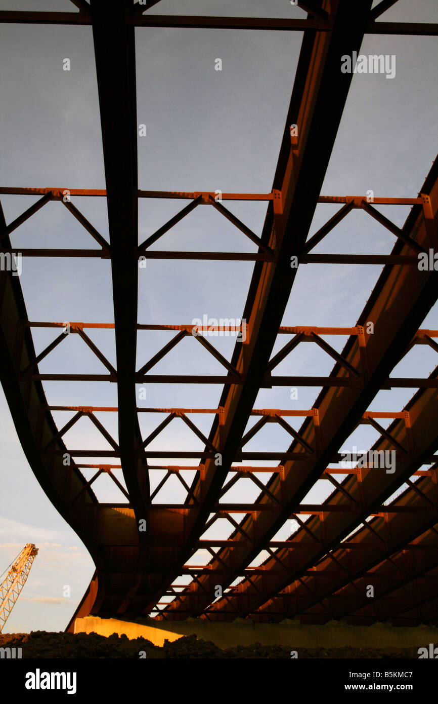 Steel frame of new bridge under construction, from beneath Stock Photo ...