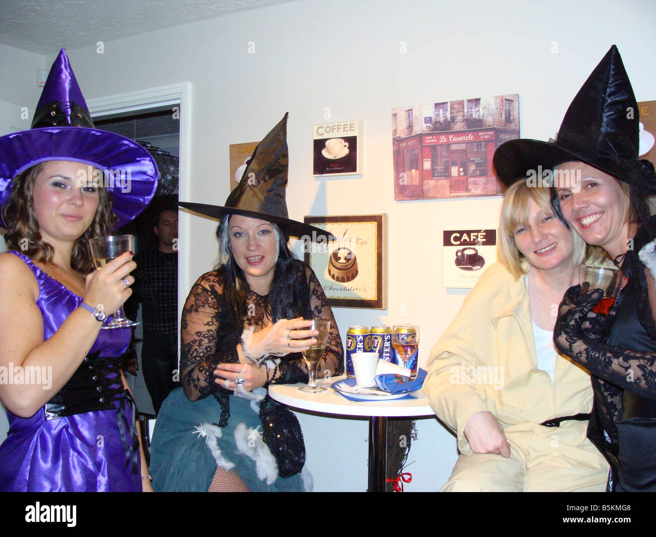 A gaggle of witches and a ghost buster at a Halloween fancy dress party ...