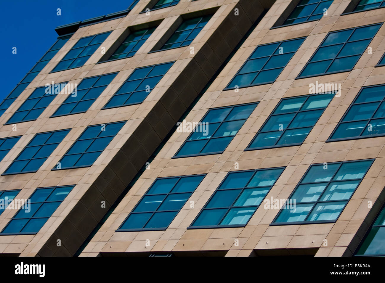 A building in Manchester reflecting the blue sky, shot taken at an ...