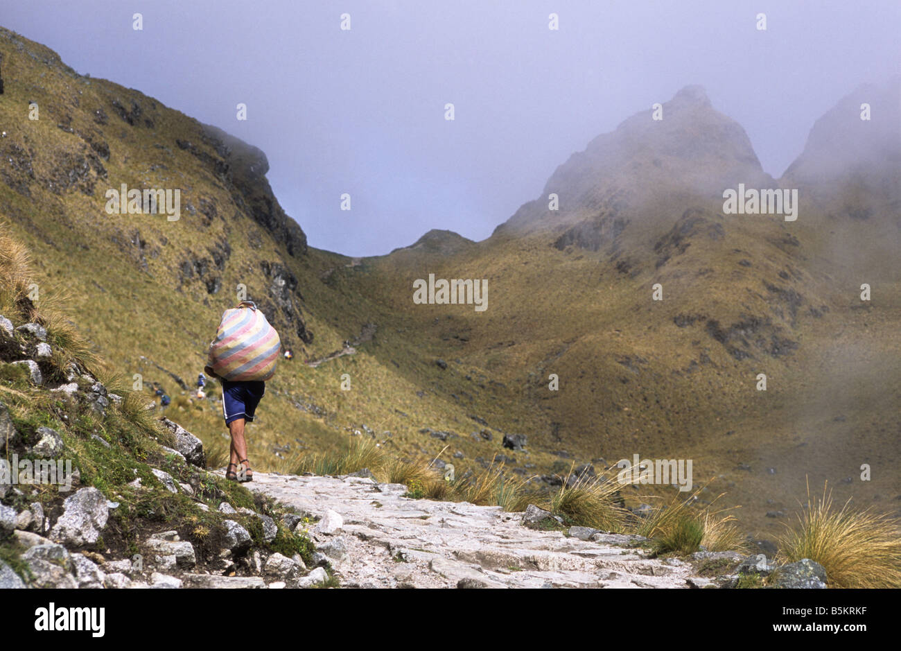 Porter approaching Dead Woman Pass, the high point of the main Inca ...