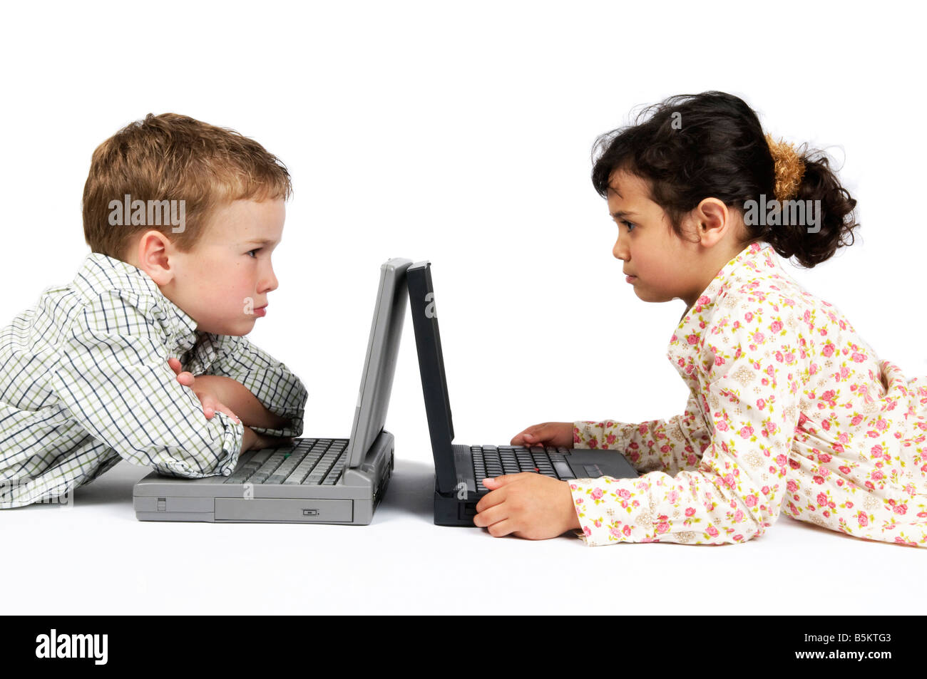 Two kids working on their laptop Something made them angry Stock Photo ...