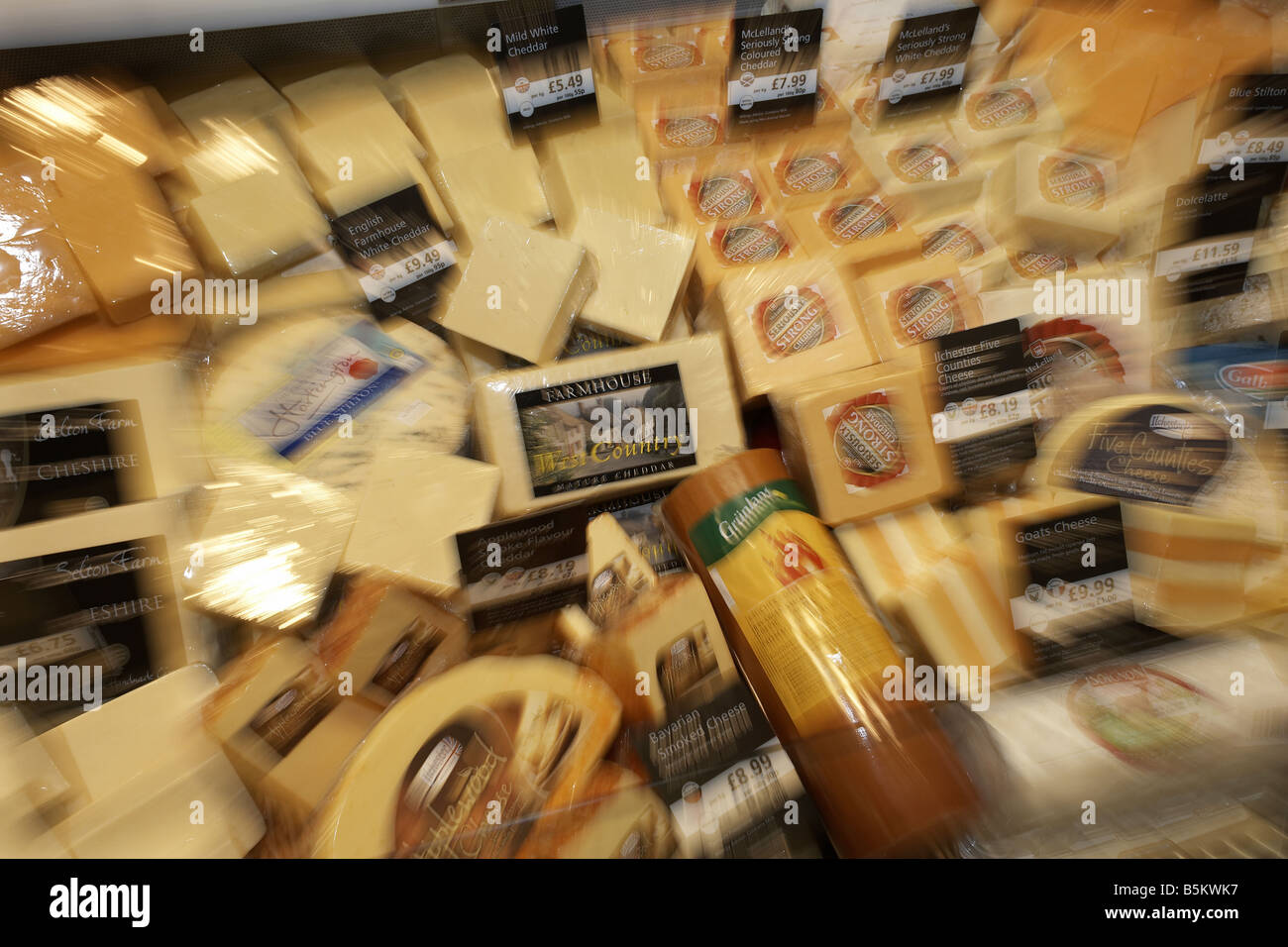 Supermarket interior Cheese blurred fast effect Stock Photo - Alamy