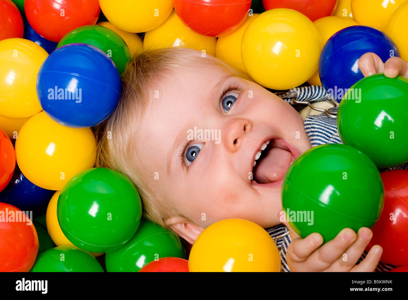 child playing in ball pit Stock Photo - Alamy