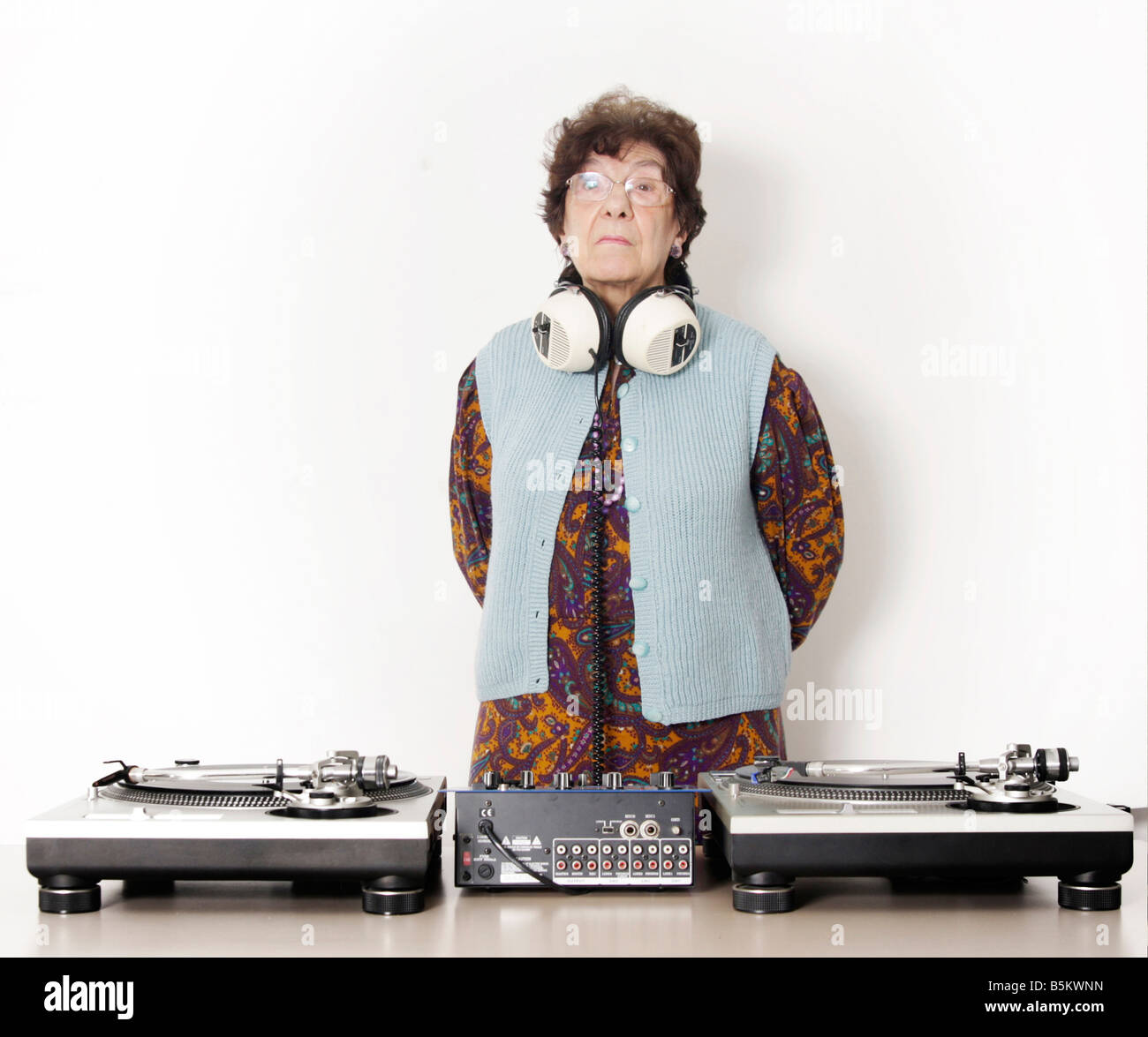 a very funky elderly granny dj go lady Stock Photo - Alamy