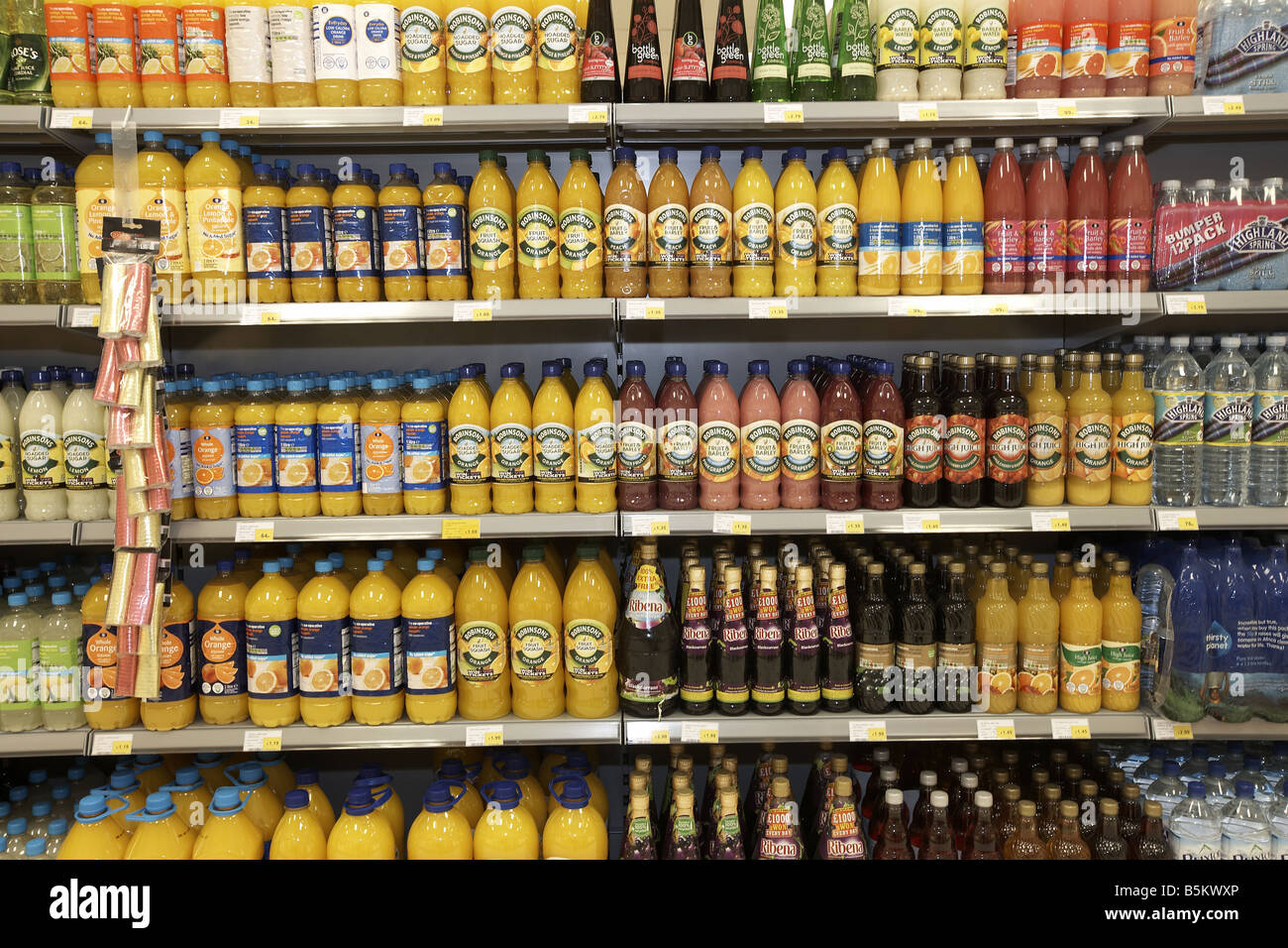 Soft drinks on display in supermarket interior Stock Photo - Alamy