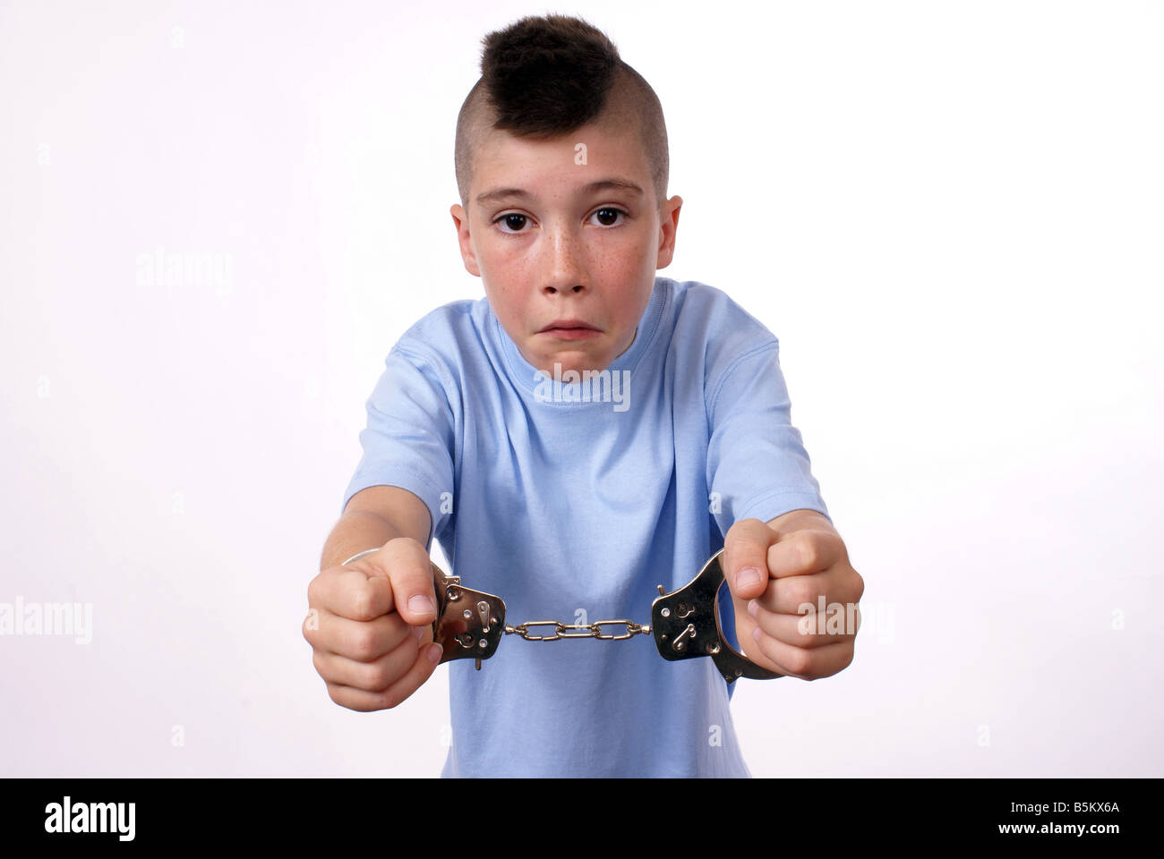 Child handcuffs hi-res stock photography and images - Alamy